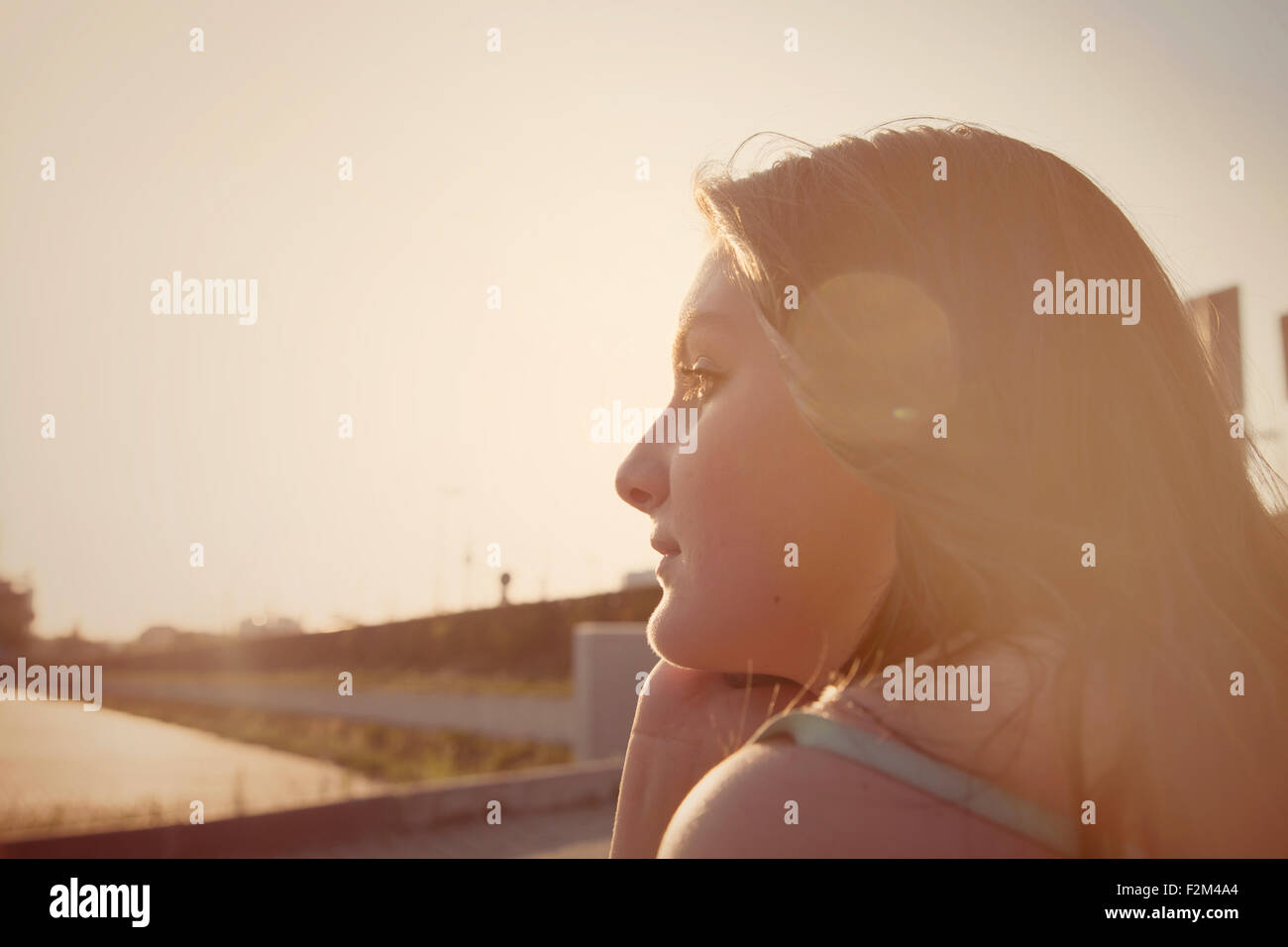 Pensive teenage girl at backlight Stock Photo - Alamy