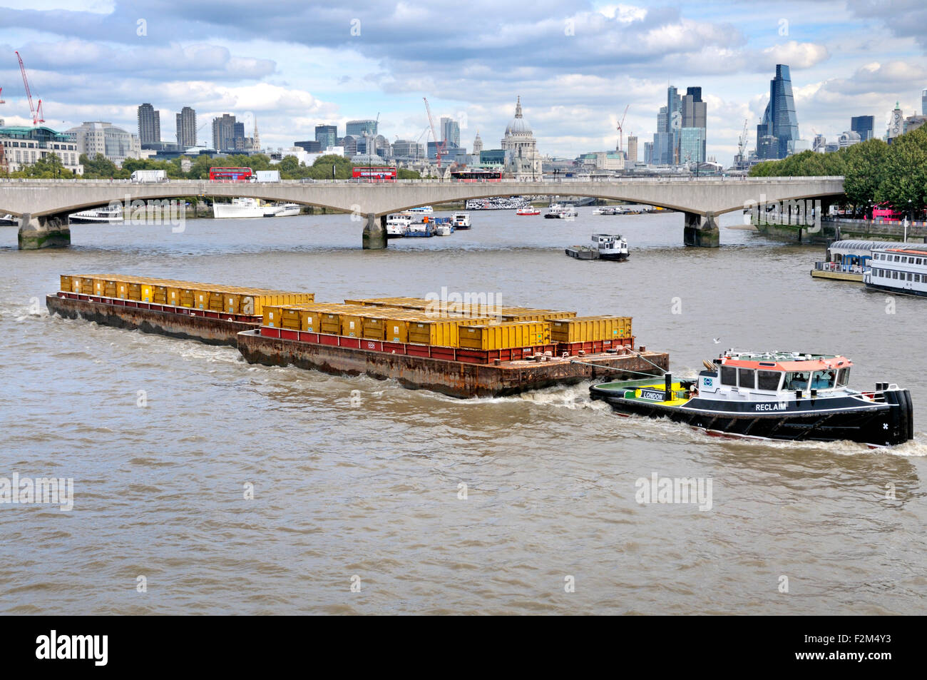 London, England, UK. Containers being transported down the Thames on ...