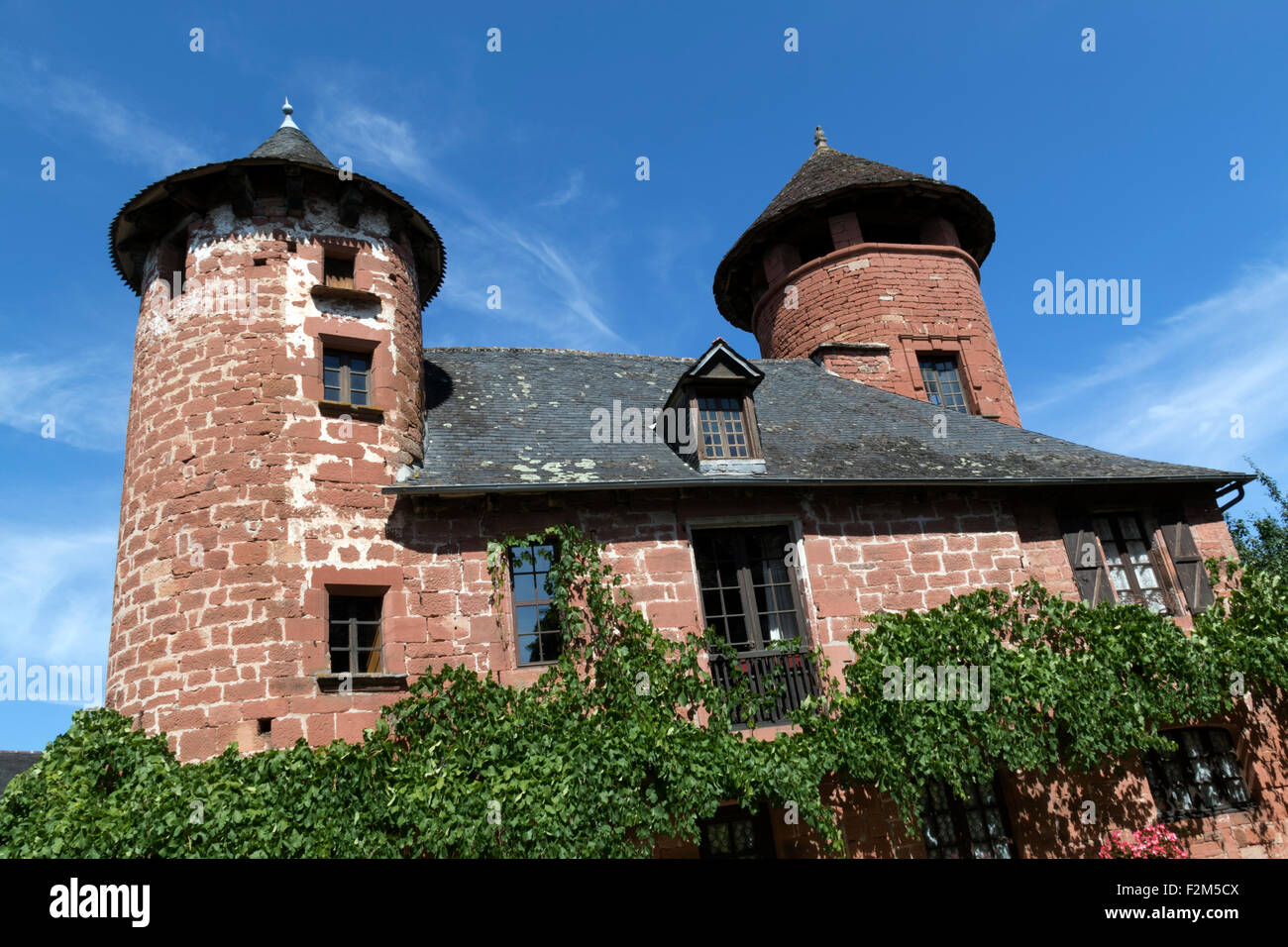 Bricked red towers in the French village of Collonges-la-Rouge in the ...