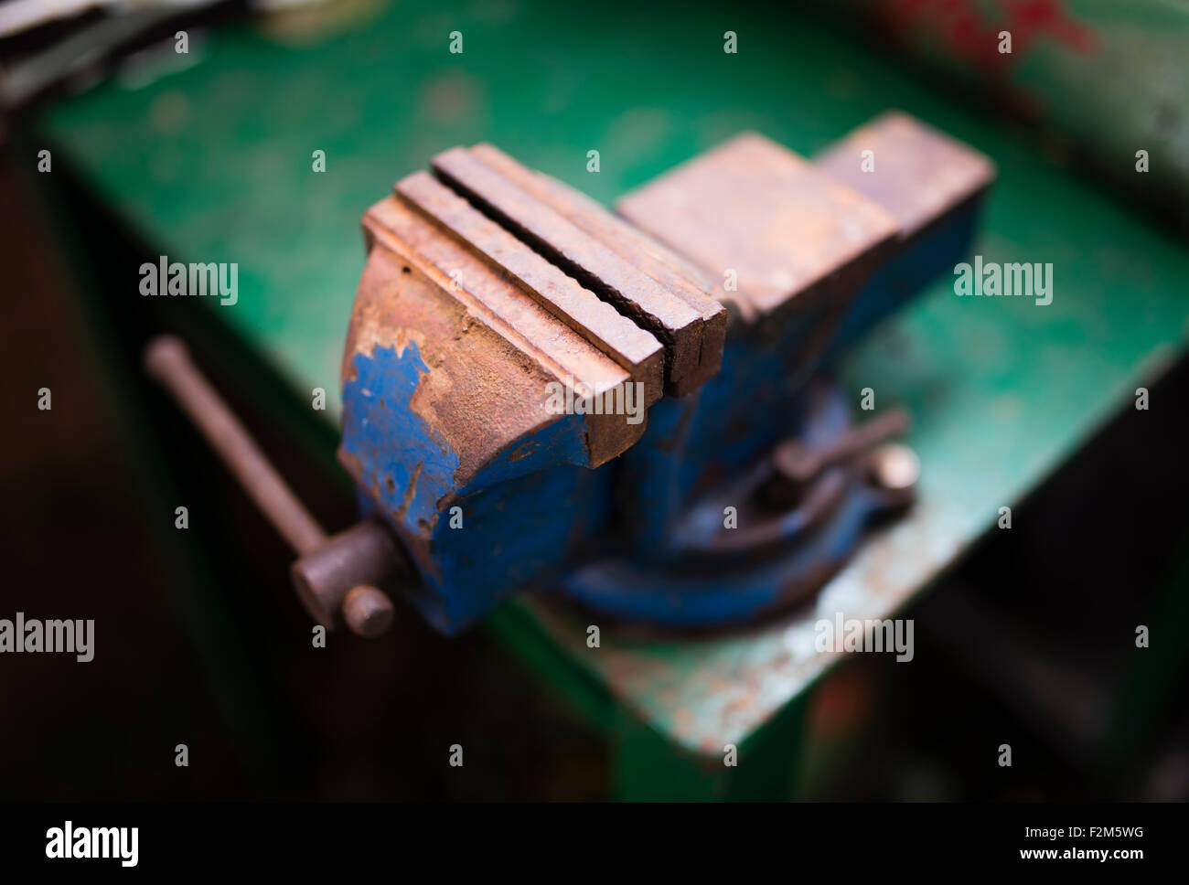 Old bench vice in a workshop Stock Photo - Alamy