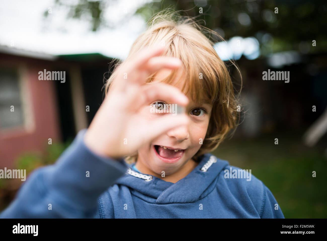 Portrait of little boy making faces Stock Photo - Alamy