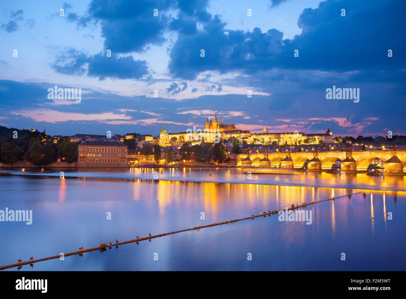 Charlesbridge and Prague Castle during the blue hour Stock Photo - Alamy