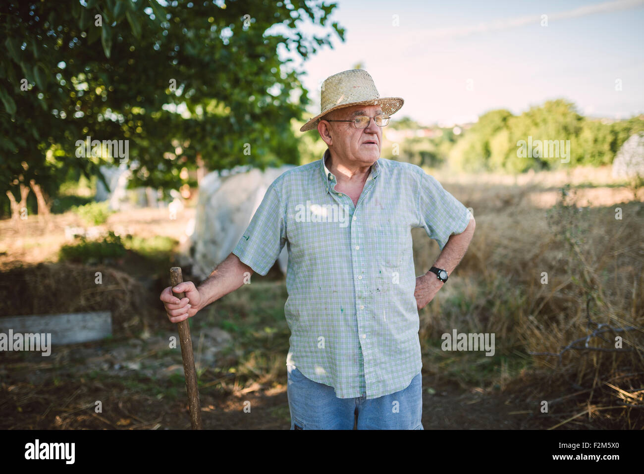 Farmer wearing straw hat standing hi-res stock photography and images ...