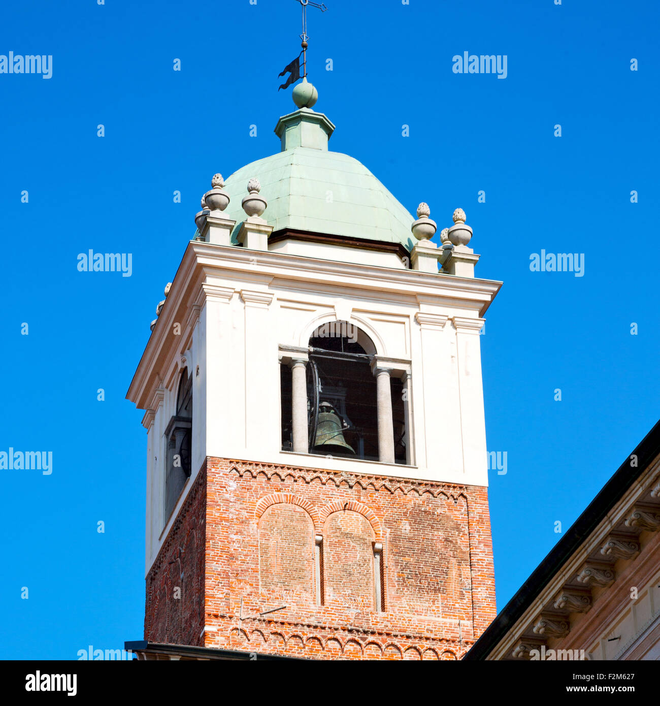 ancien clock tower in italy europe old stone and bell Stock Photo - Alamy
