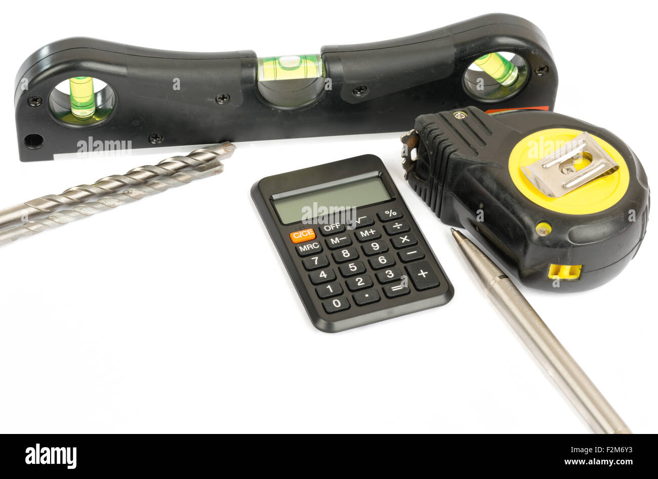 Builders level with calculator Stock Photo - Alamy