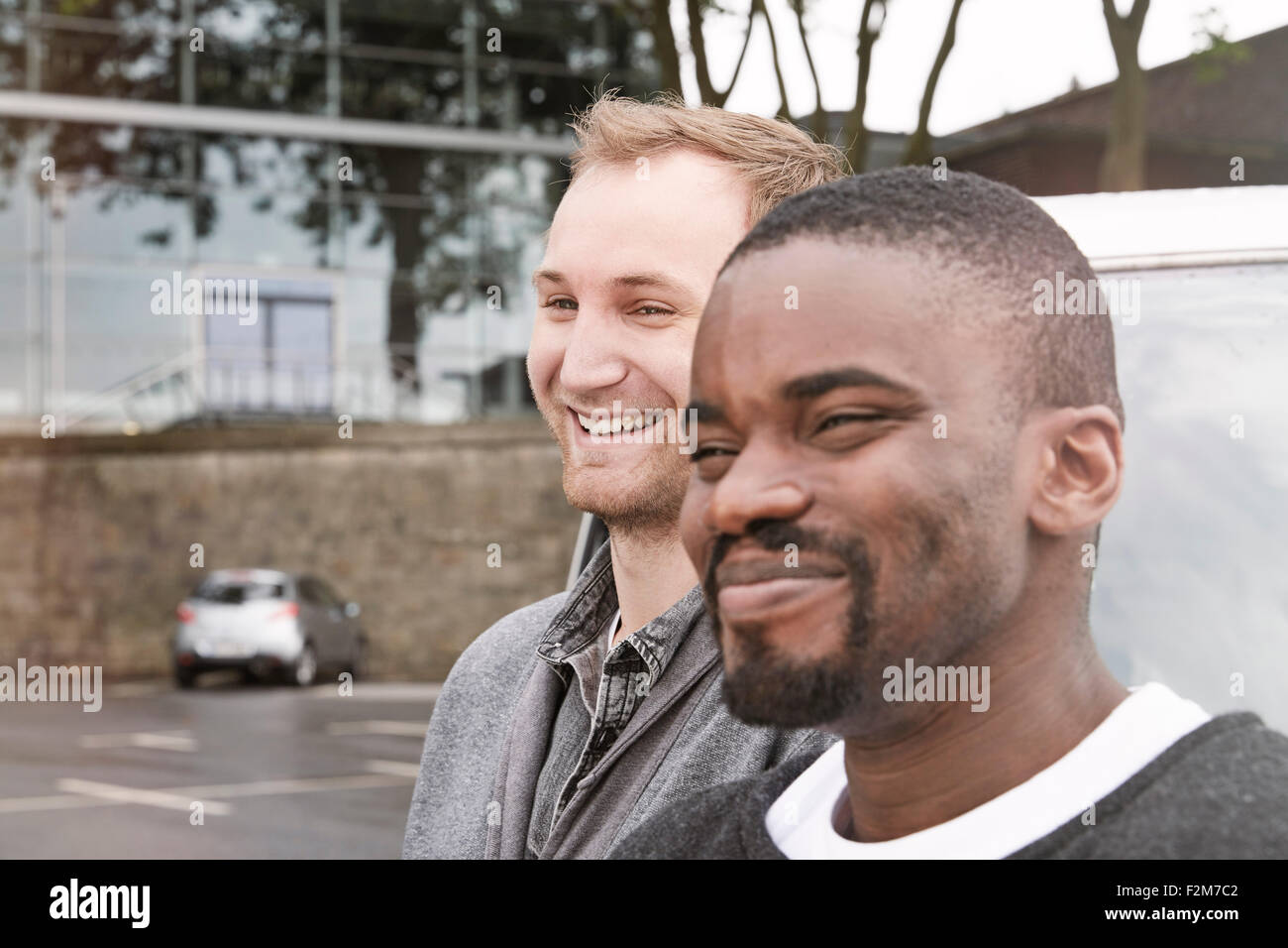 Two smiling men outdoors Stock Photo - Alamy