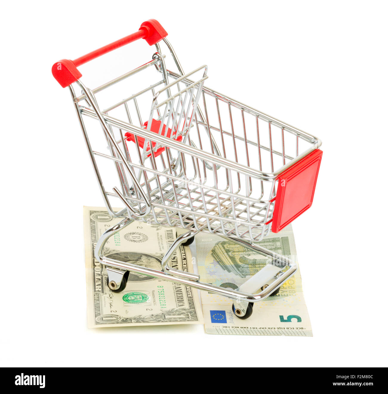Shopping cart on money Stock Photo - Alamy