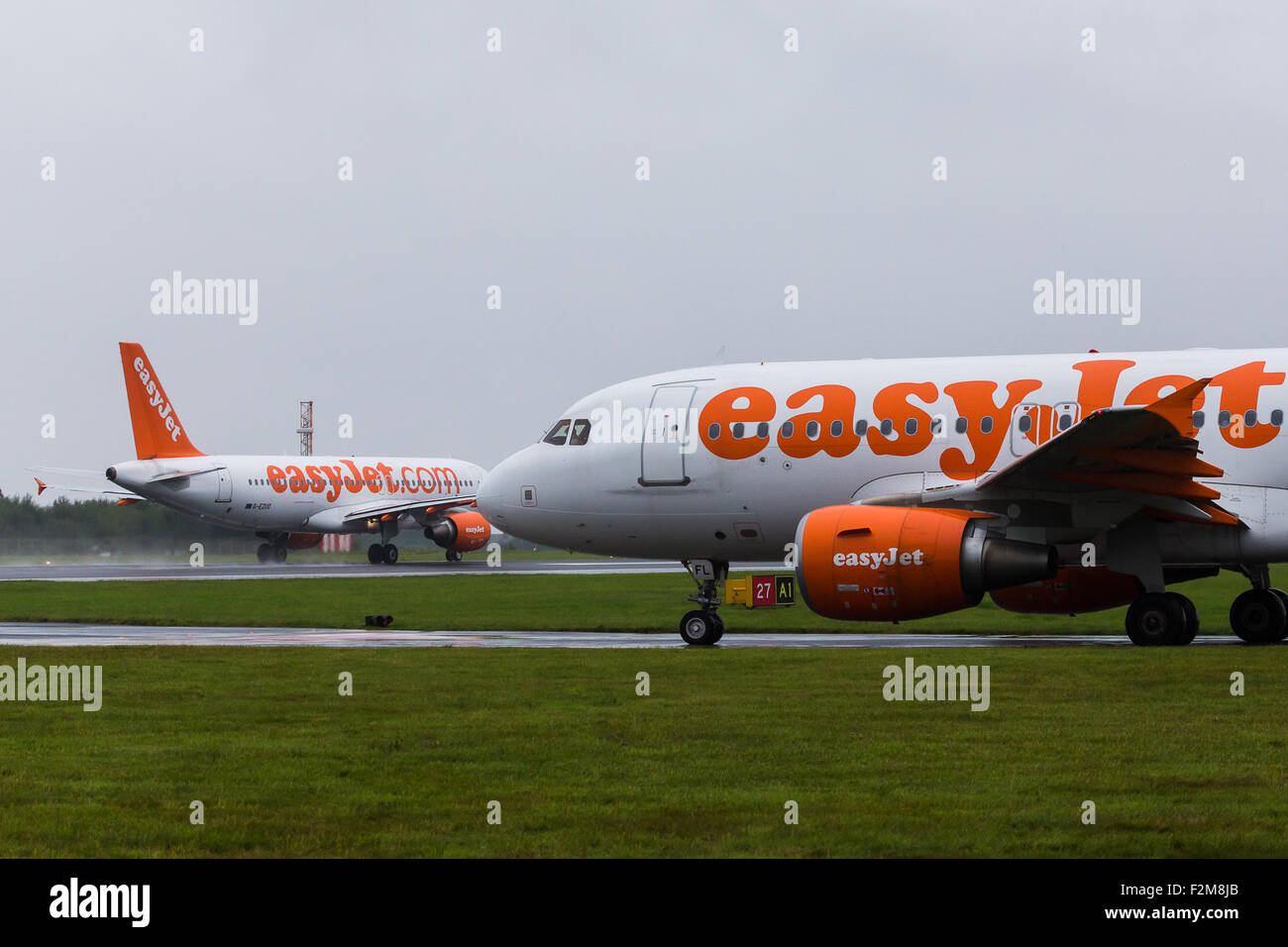Easyjet pair taking off at Liverpool airport Stock Photo - Alamy
