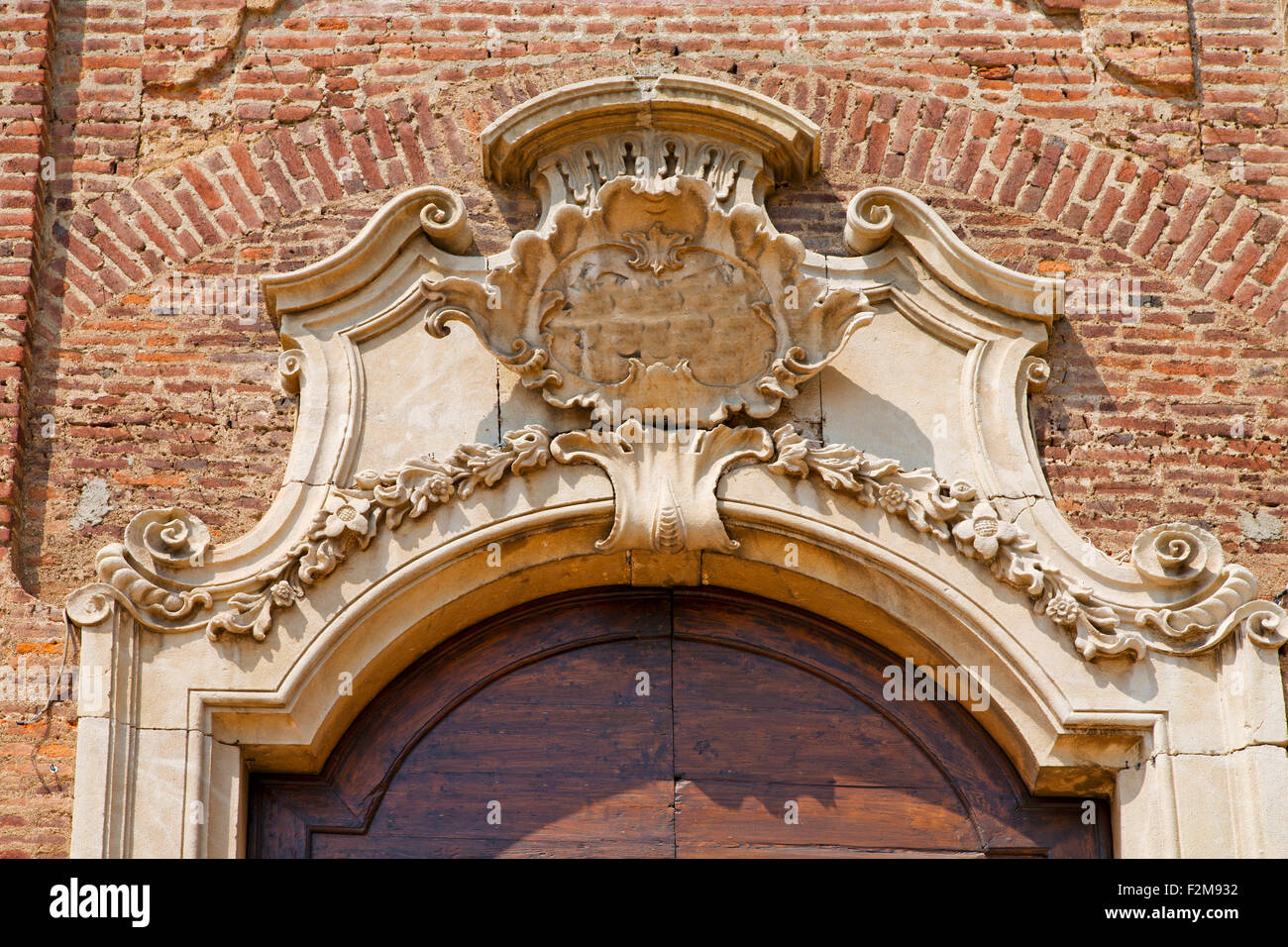 church door in italy lombardy column the milano old closed brick Stock ...