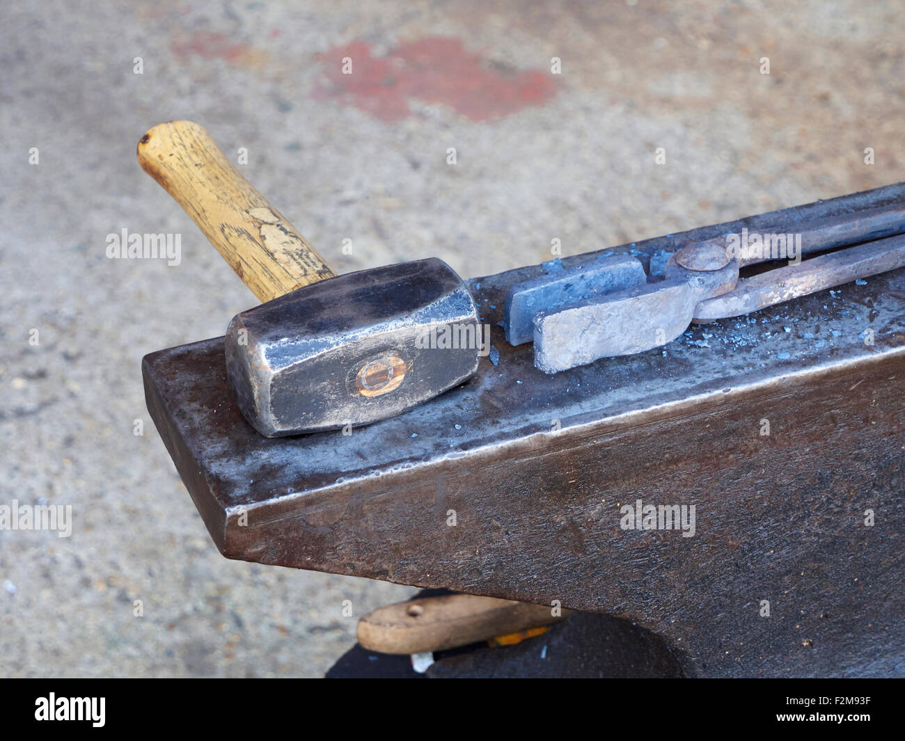 A blacksmith's hammer lies ready for use on an anvil Stock Photo - Alamy