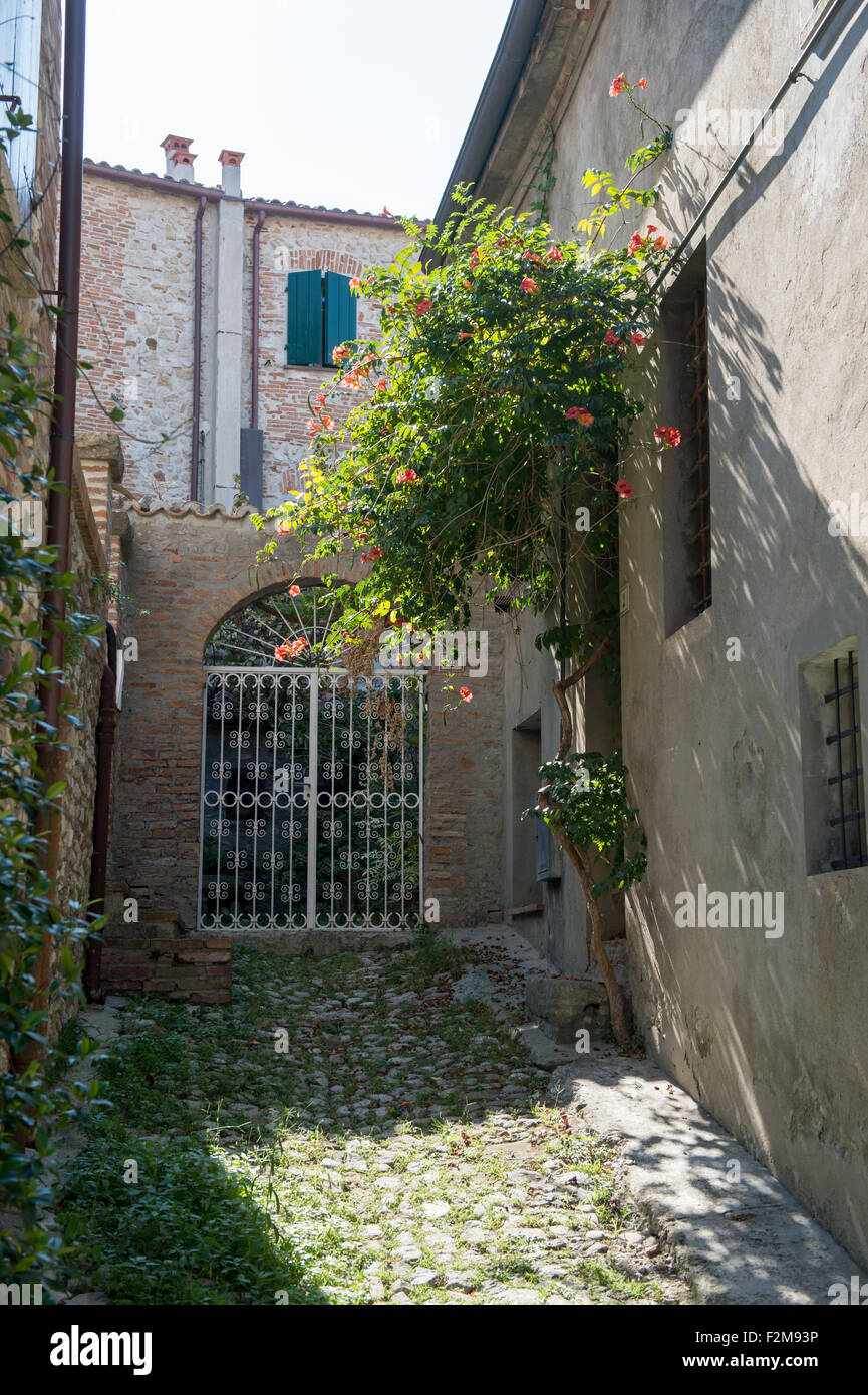 Scenic cobbled path with ornate gateway, Cervia,Italy Stock Photo - Alamy