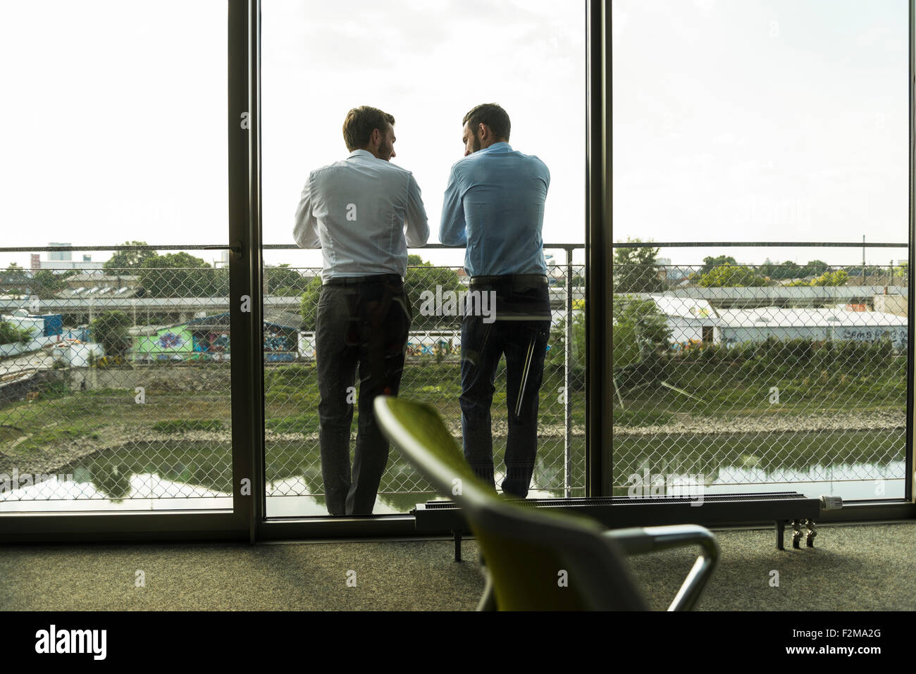 Two people on balcony behind hi-res stock photography and images - Alamy