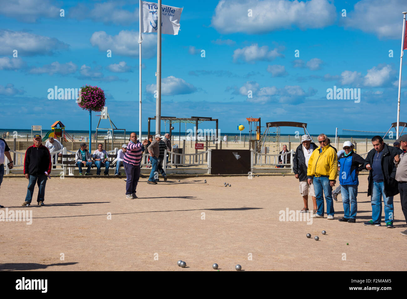 Local French men playing Boules on the Beach at Trouville Normandy ...