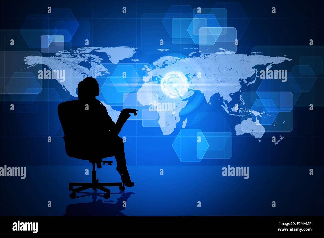 Businesswoman in chair with world map Stock Photo - Alamy