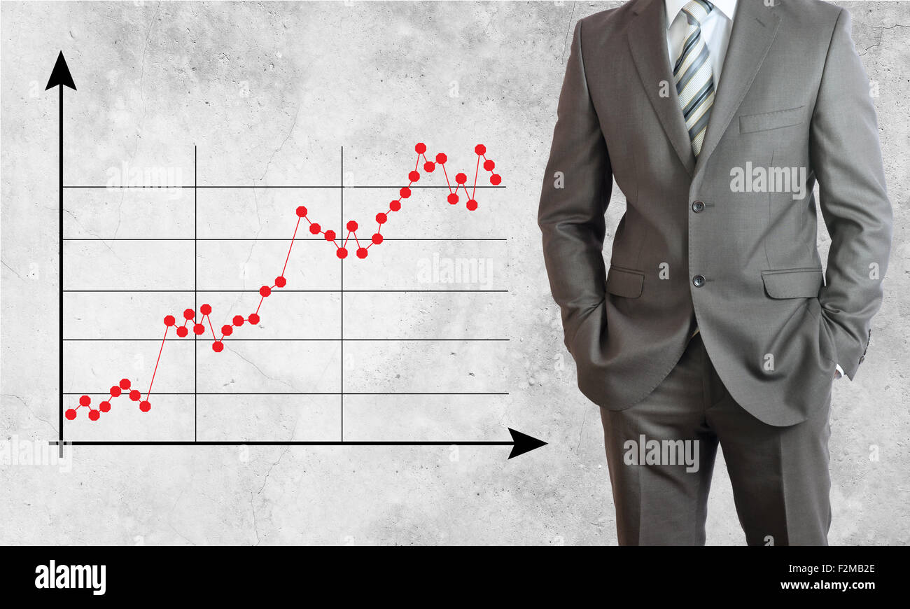Businessman with graphs Stock Photo - Alamy