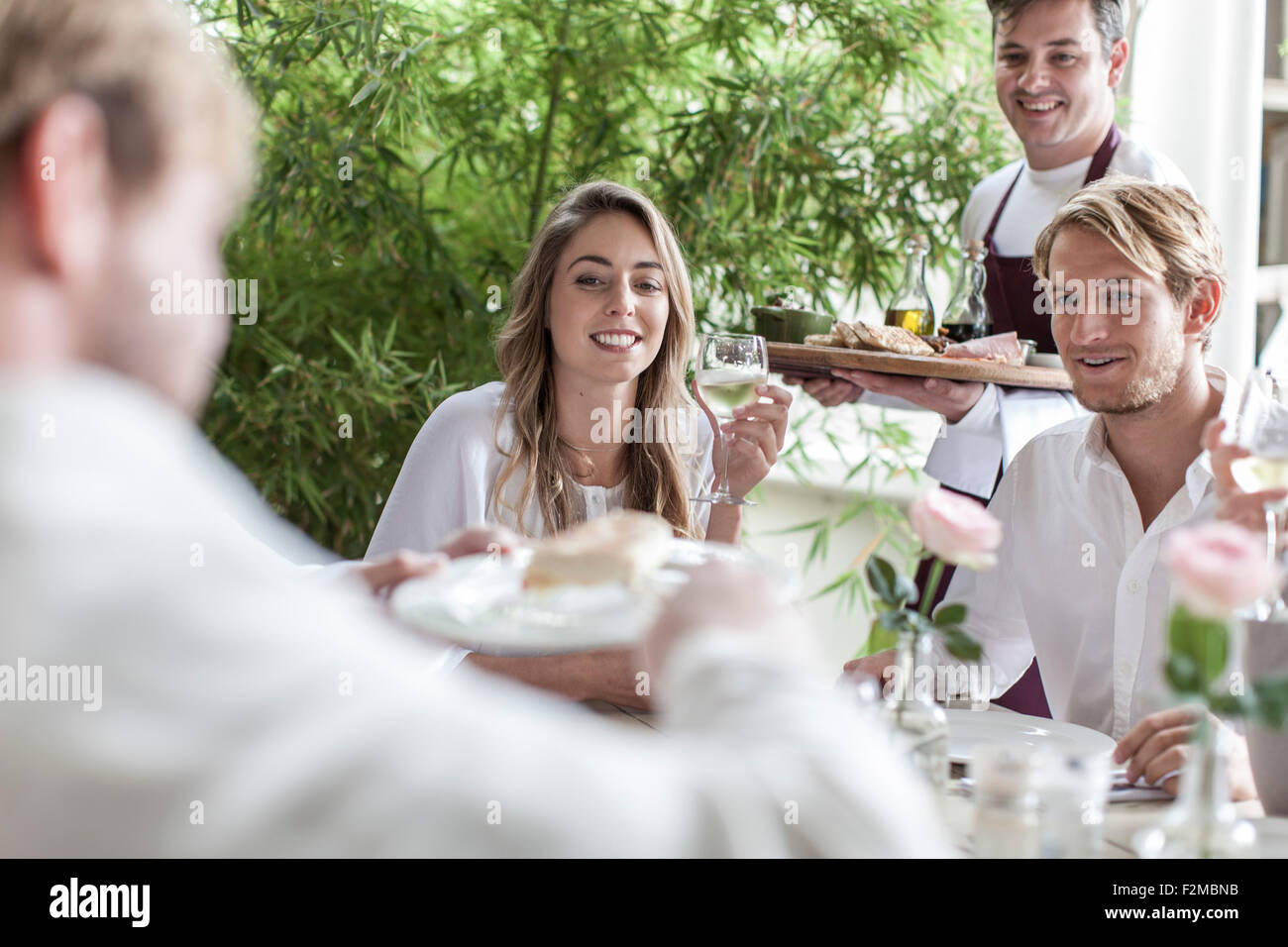 Friends having lunch together at restaurant, sitting outside Stock ...