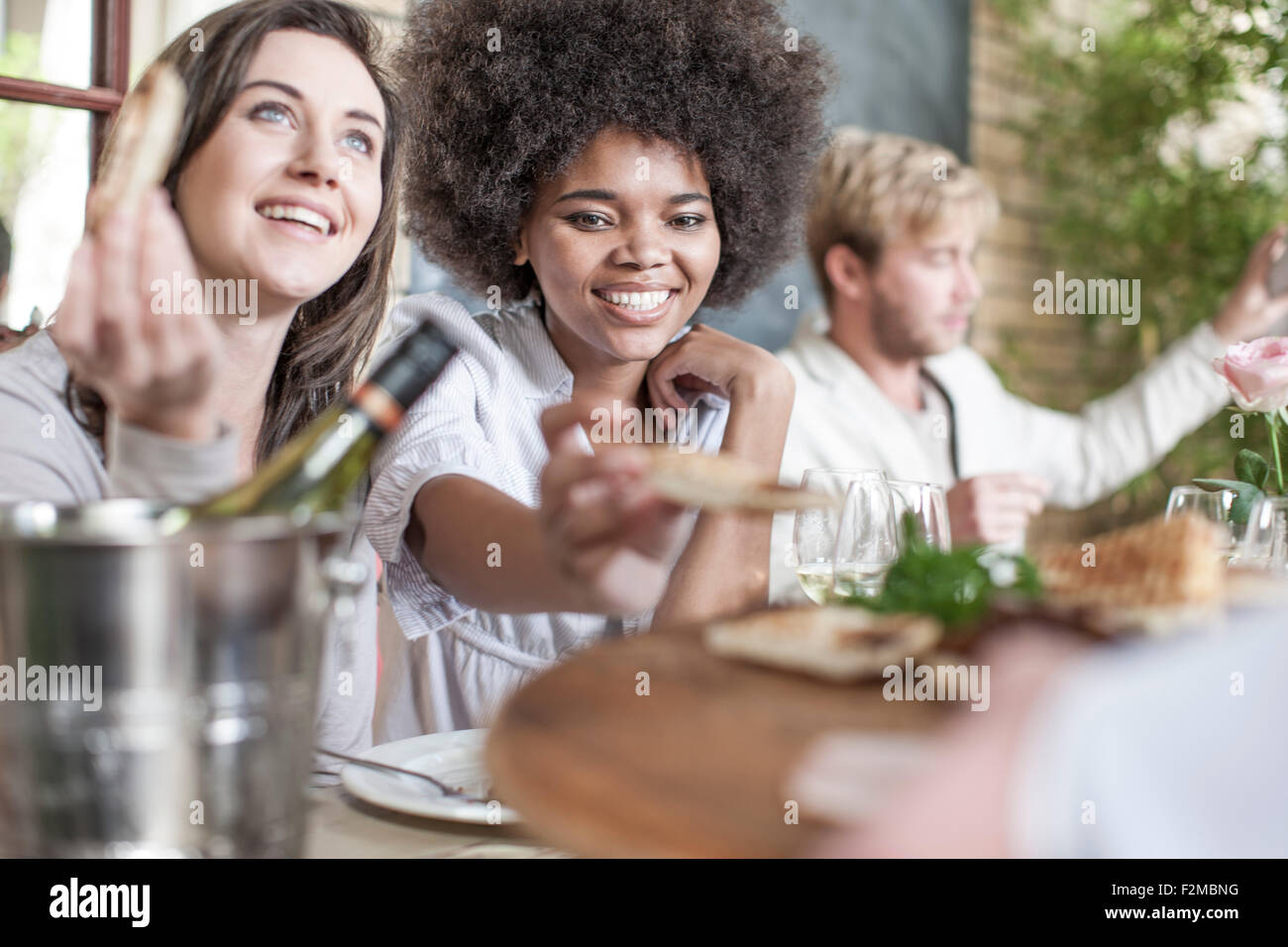Friends having lunch together at restaurant, sitting outside Stock ...