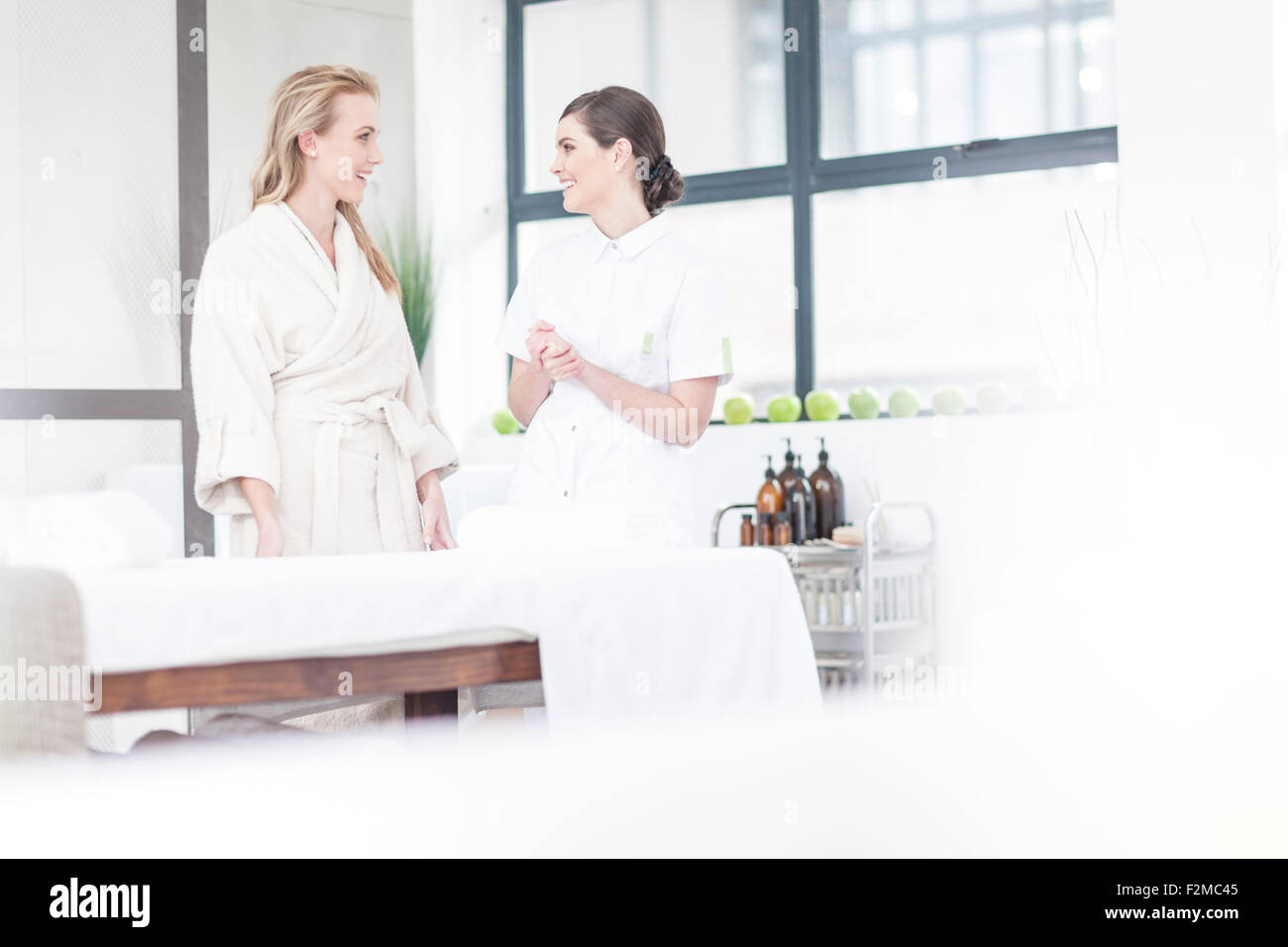 Two young women in a spa Stock Photo - Alamy