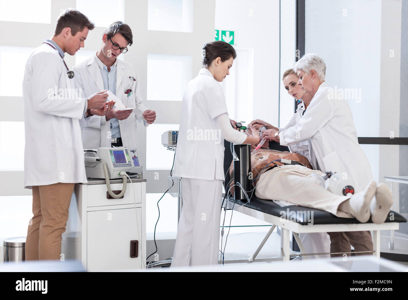 Hospital staff helping patient in emergency Stock Photo - Alamy