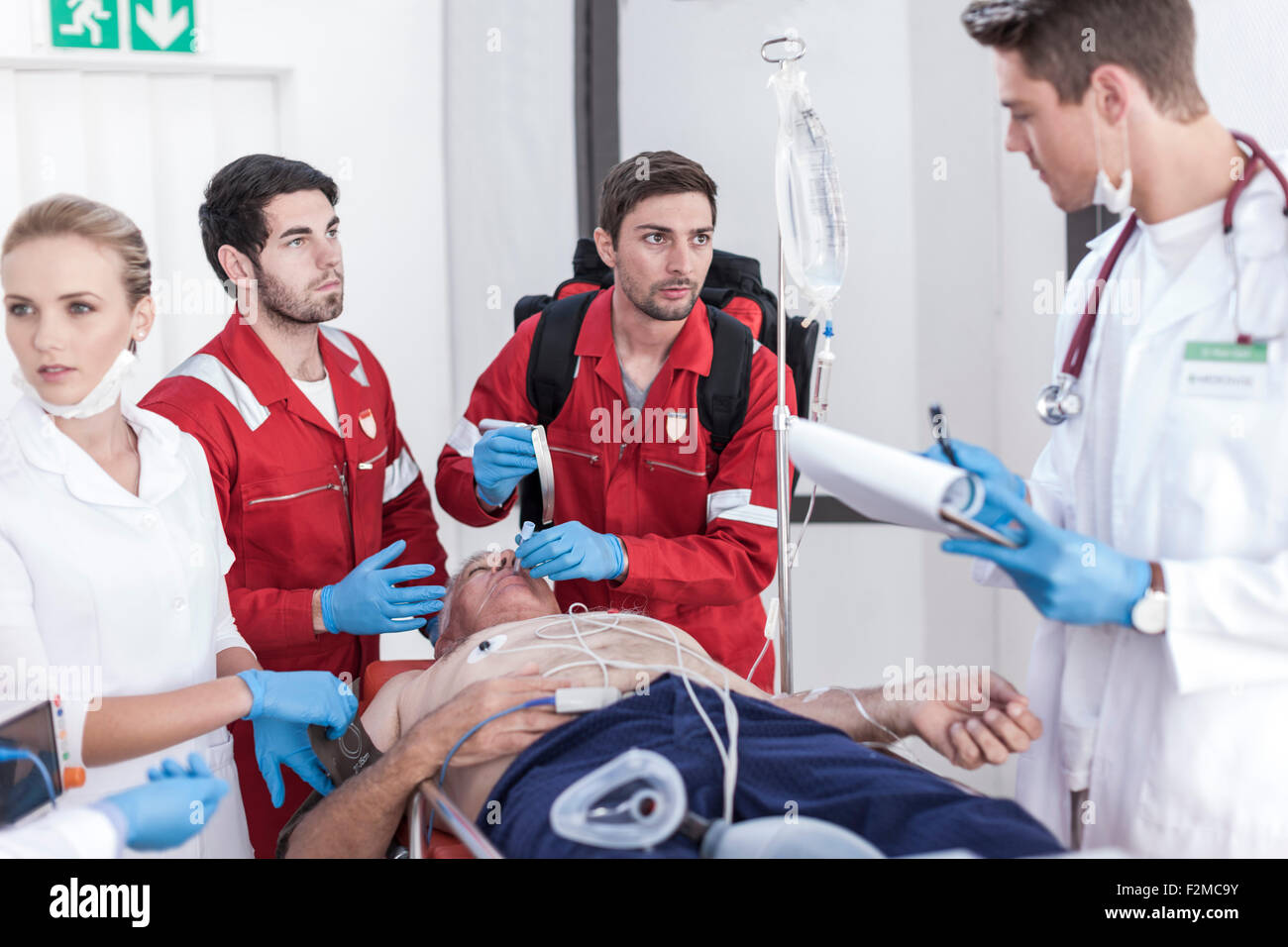 Hospital staff helping patient in emergency Stock Photo - Alamy