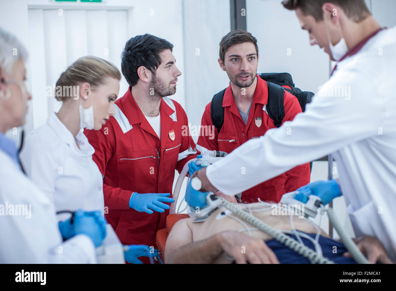 Hospital staff helping patient in emergency Stock Photo - Alamy
