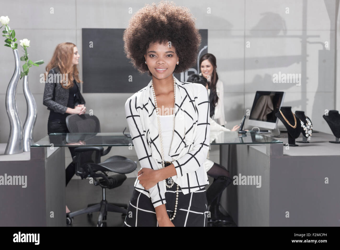 Shop assistant in a boutique Stock Photo - Alamy