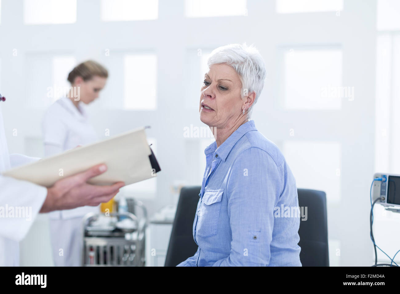 Senior woman doing check up at the doctor's Stock Photo - Alamy