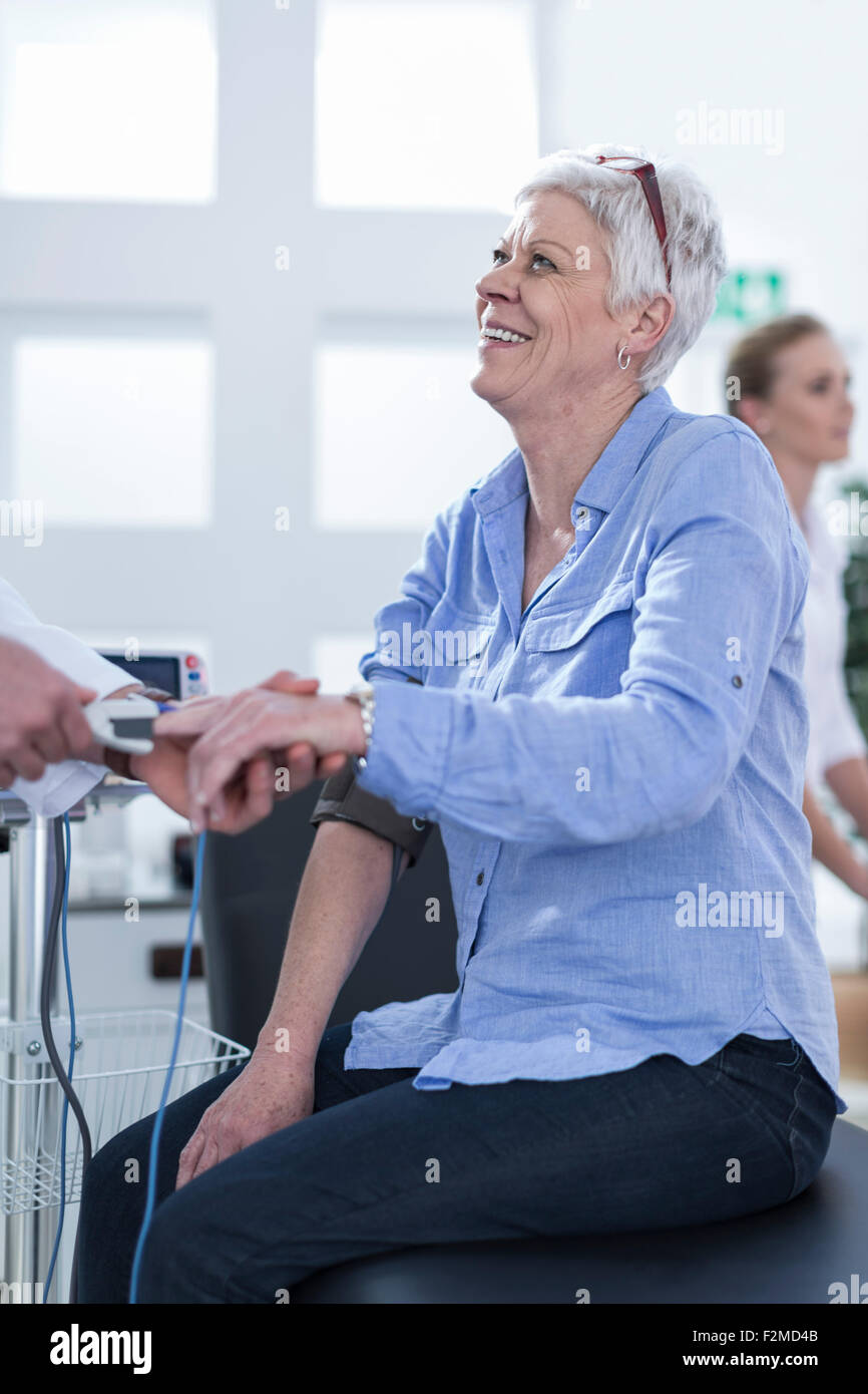 Senior woman doing check up at the doctor's Stock Photo - Alamy