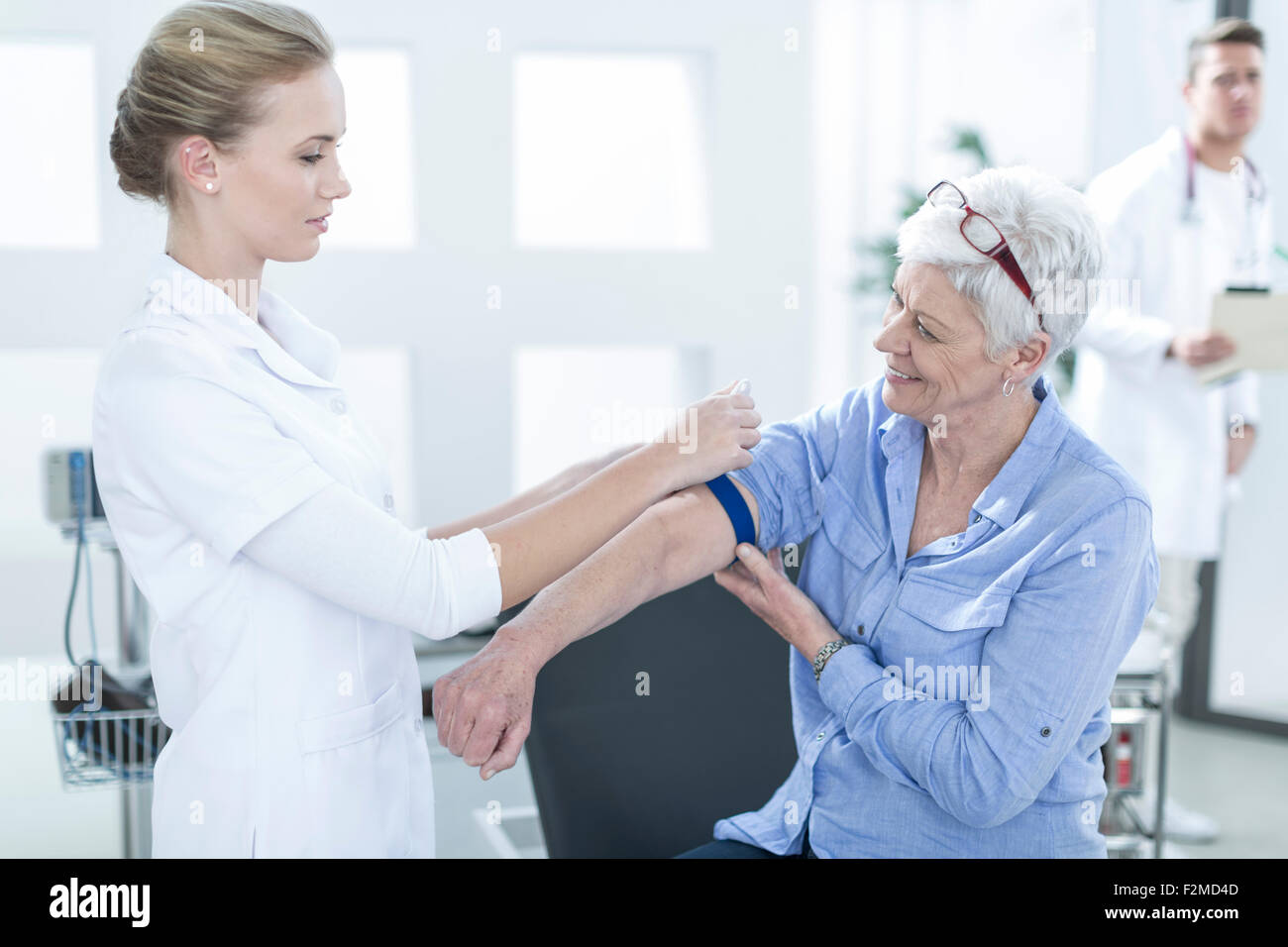 Senior woman doing check up at the doctor's Stock Photo - Alamy
