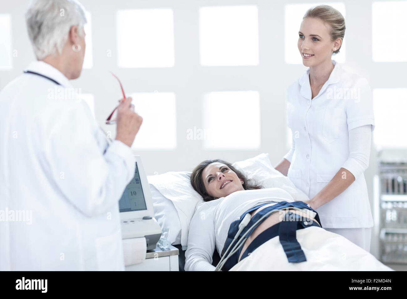 Pregnant woman getting medical check up Stock Photo - Alamy