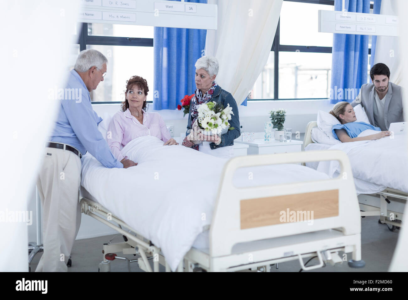 Sick bed visit in hospital Stock Photo - Alamy