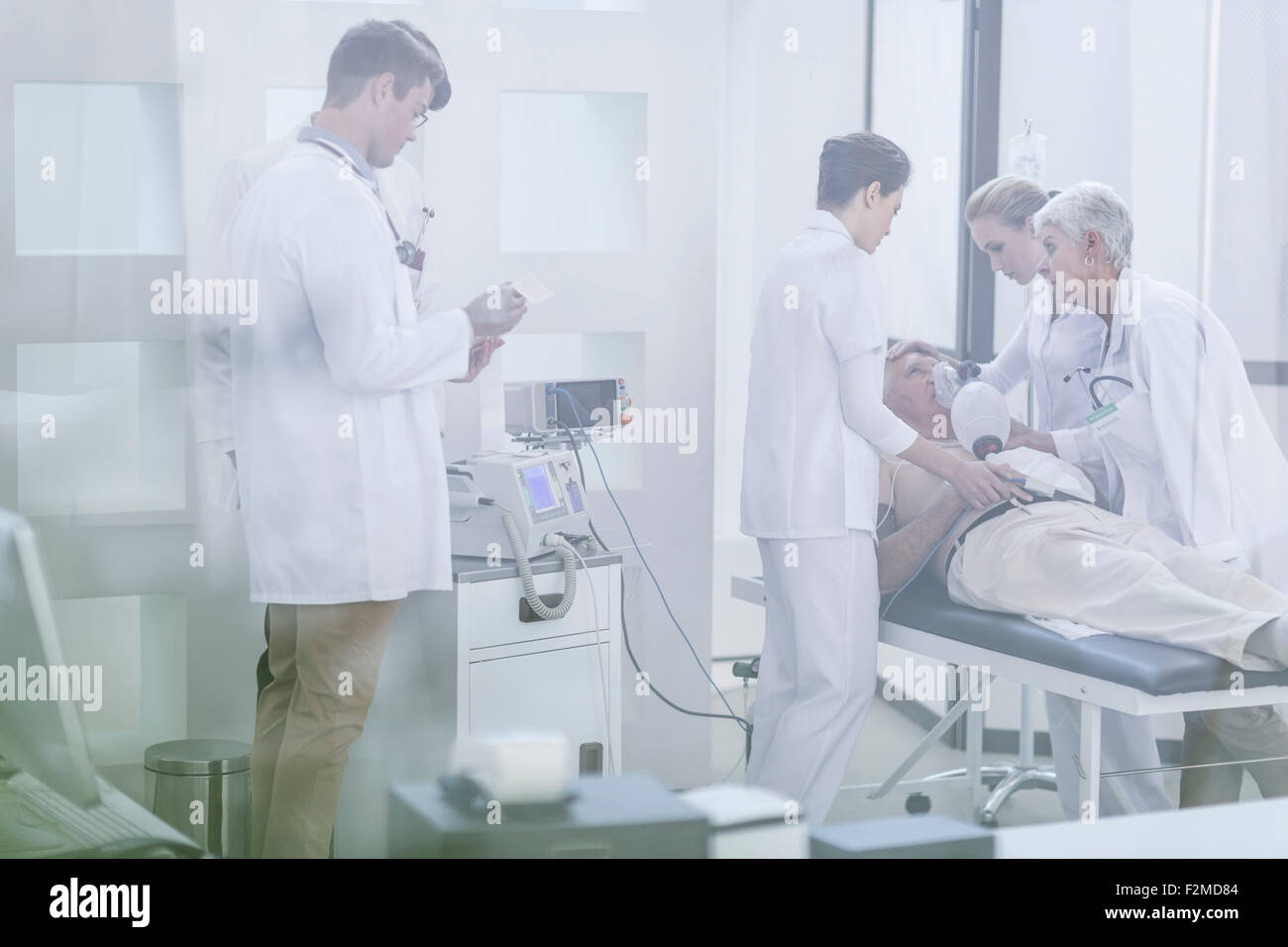 Hospital staff helping patient in emergency Stock Photo - Alamy