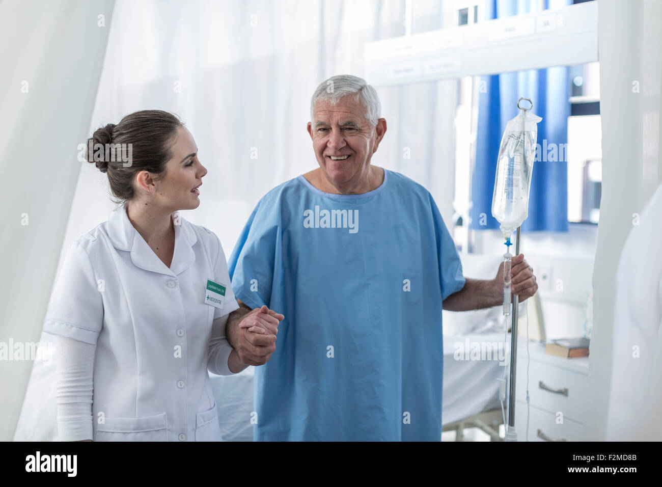 Nurse supporting senior patient in hospital Stock Photo - Alamy