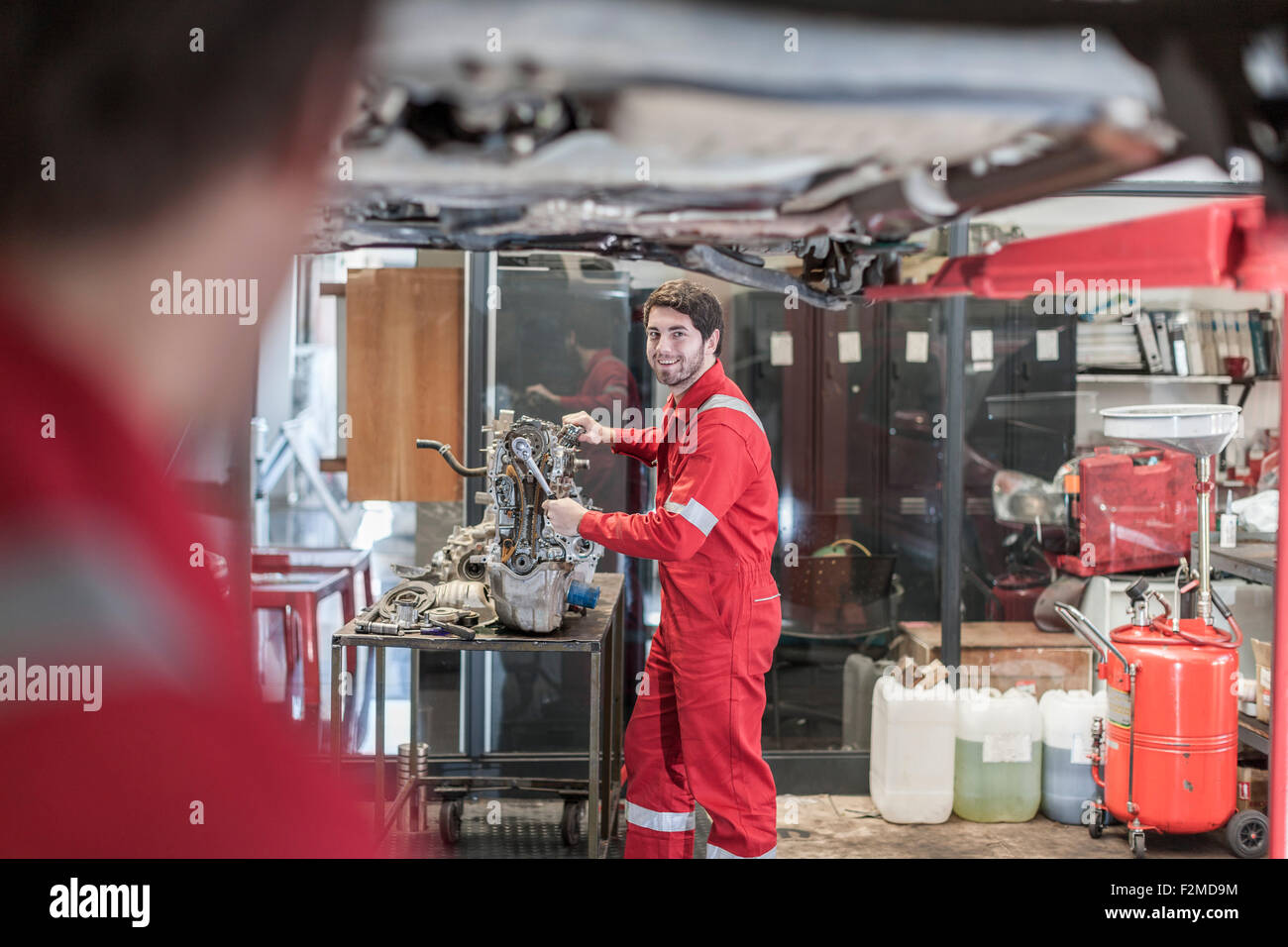 Car mechanics at work in repair garage Stock Photo - Alamy