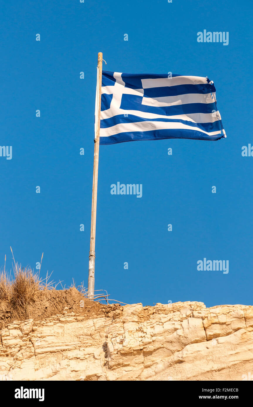 Greek flag on a pole against blue sky Stock Photo - Alamy