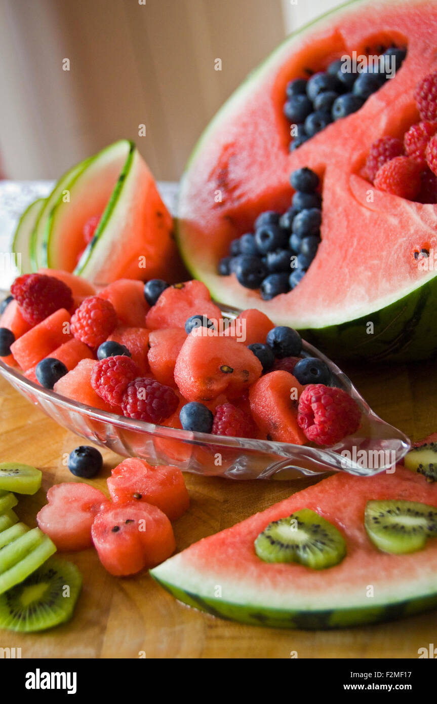 Vertical close up of cut and shaped watermelon as part of a fruit salad ...
