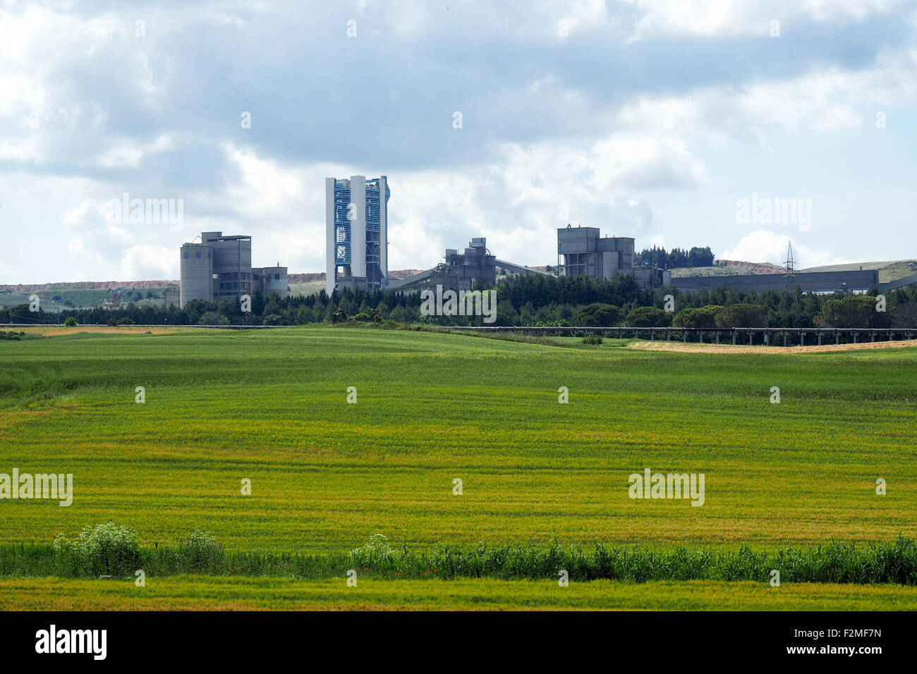 A cement works located amongst farming land Stock Photo - Alamy
