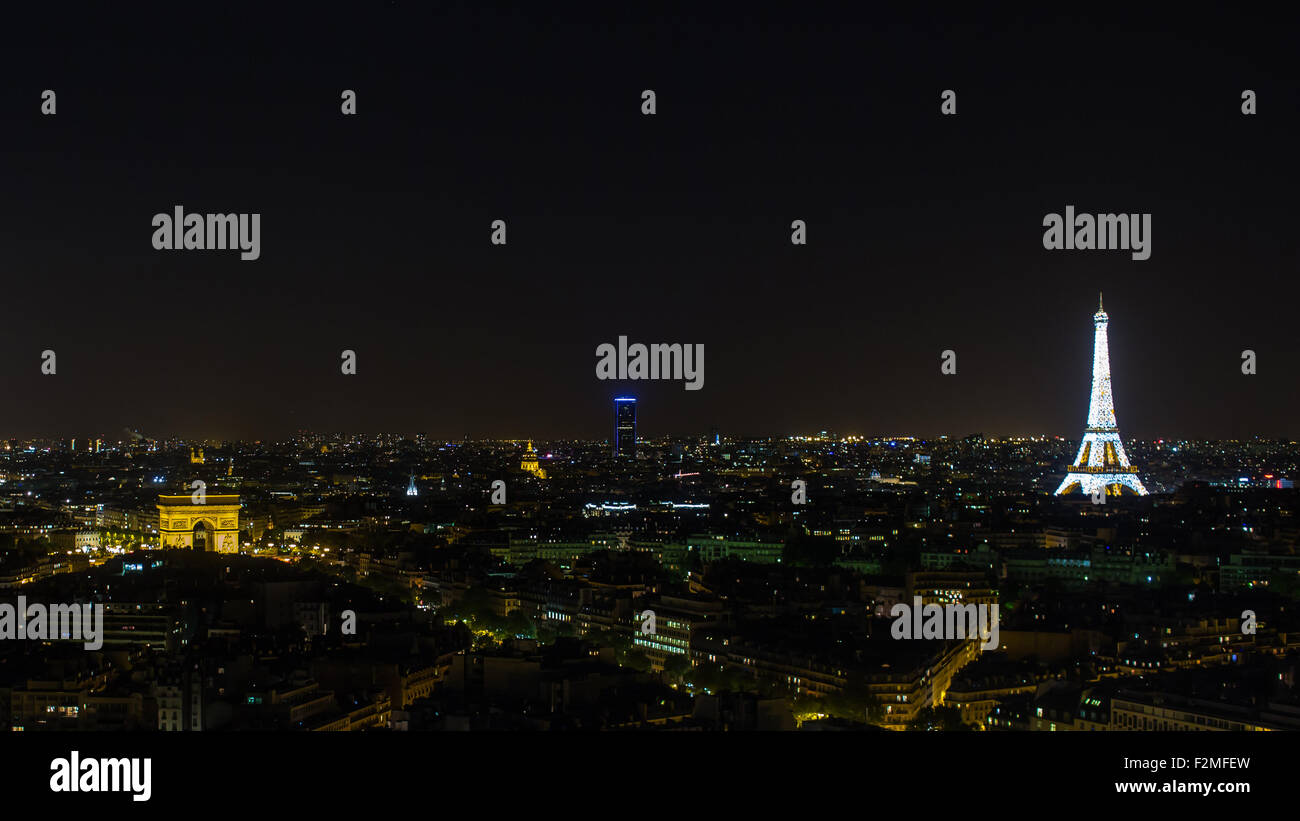 Eiffel Tower and Arc de Triomphe viewed over rooftops, Paris, France, Europe Stock Photo - Alamy