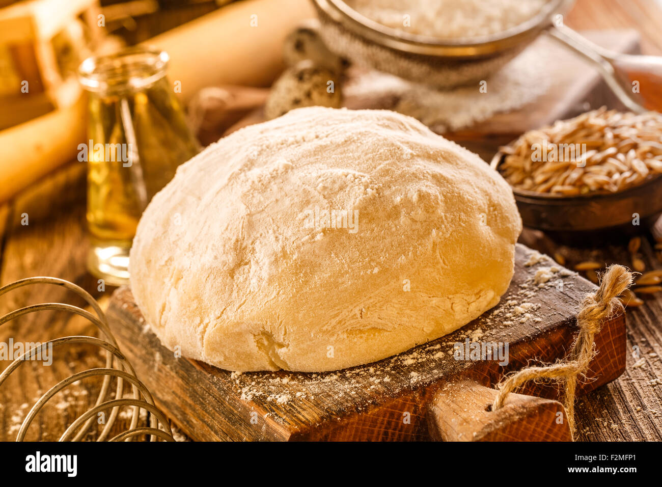 Prepared dough on the vintage wooden board Stock Photo - Alamy