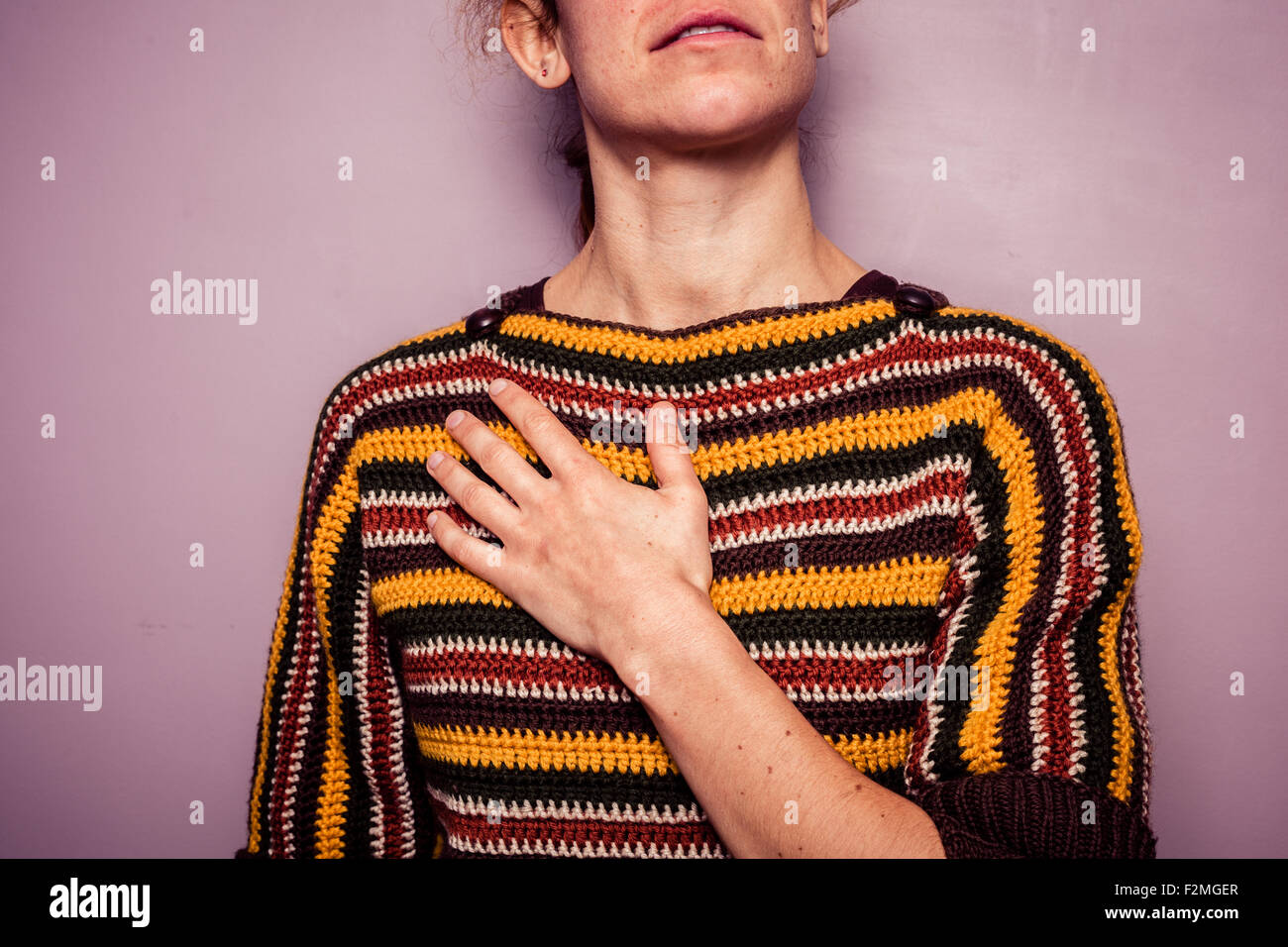 Woman hand heart chest hi-res stock photography and images - Alamy