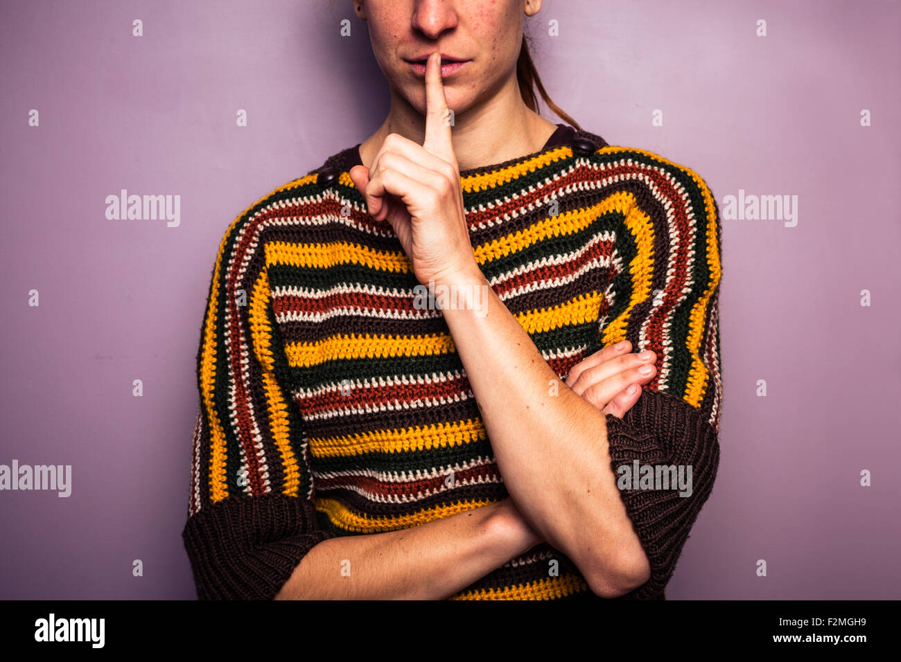 Finger over mouth quiet hi-res stock photography and images - Alamy