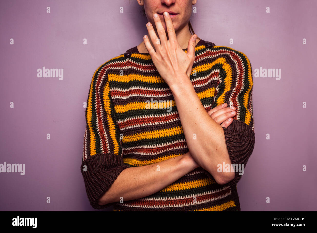 Young woman touching her lips Stock Photo - Alamy