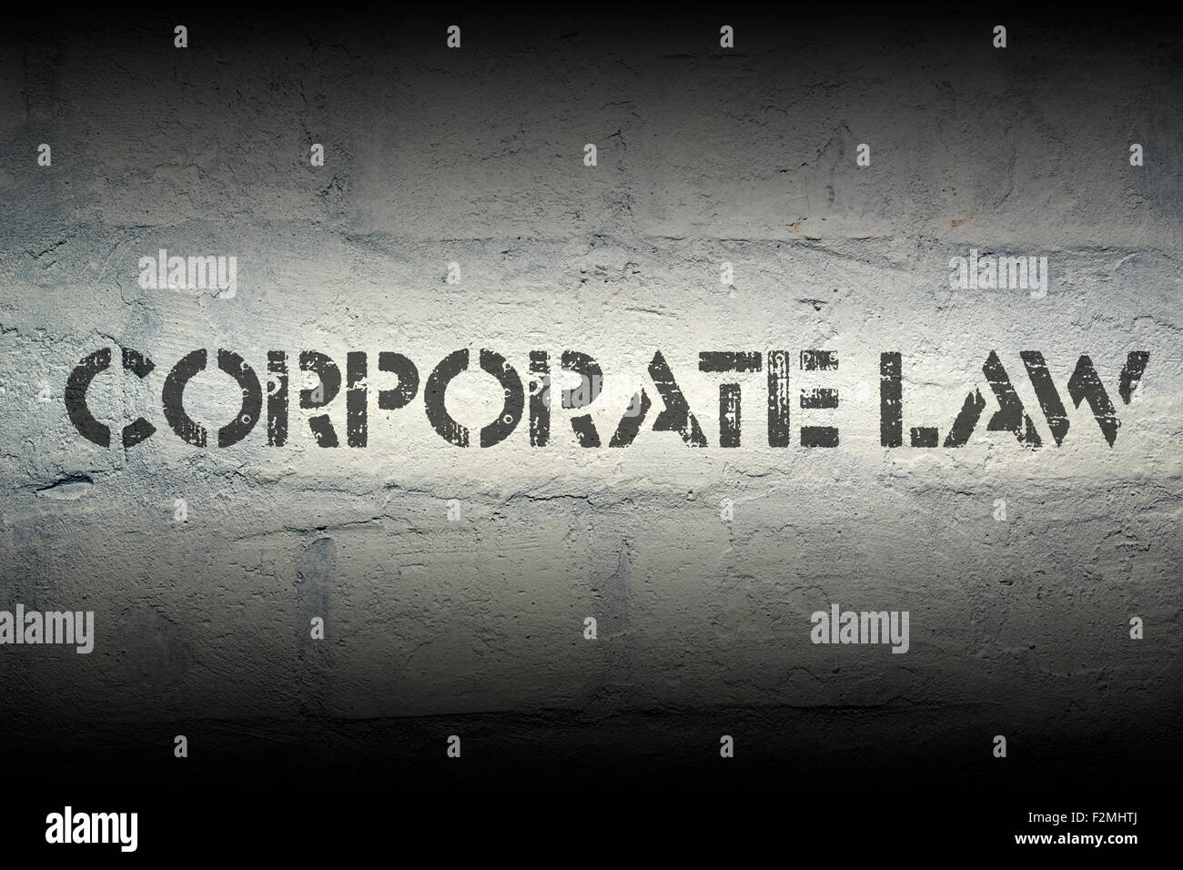 corporate law stencil print on the grunge white brick wall Stock Photo ...