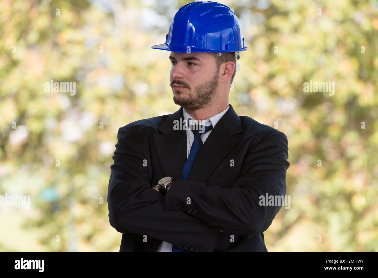 Portrait Of Business Man With Blue Helmet On Construction Stock Photo ...