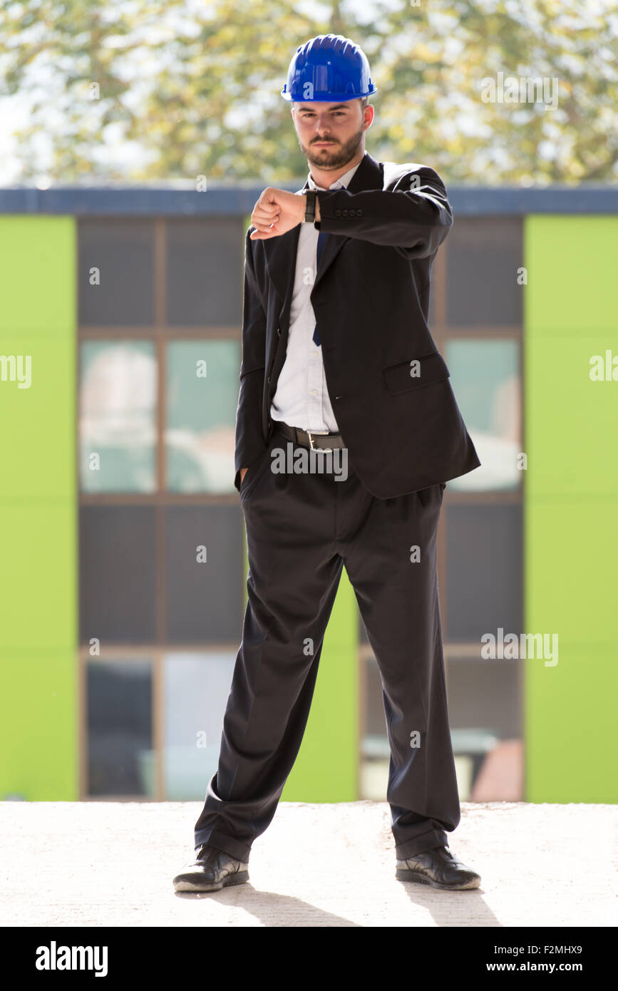 Engineer looking at watch hi-res stock photography and images - Alamy