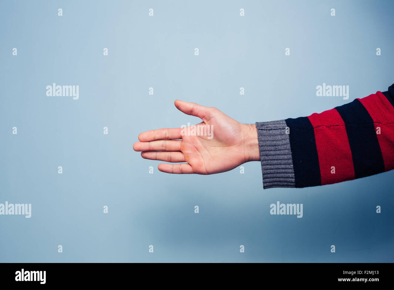 Young man offering hand handshake hi-res stock photography and images - Alamy