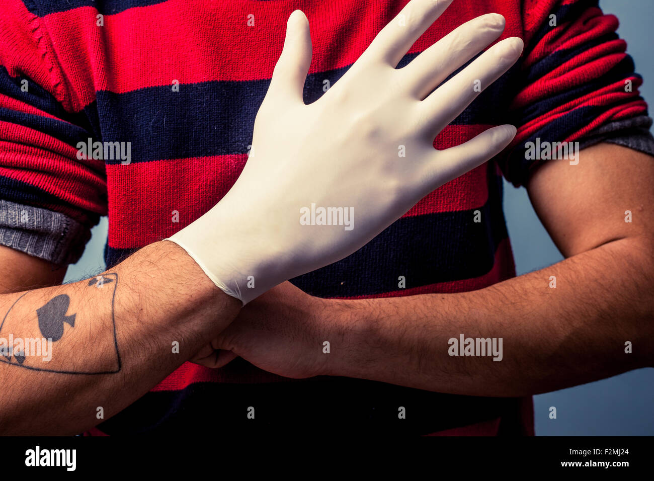 Hands woman putting on latex hi-res stock photography and images - Alamy