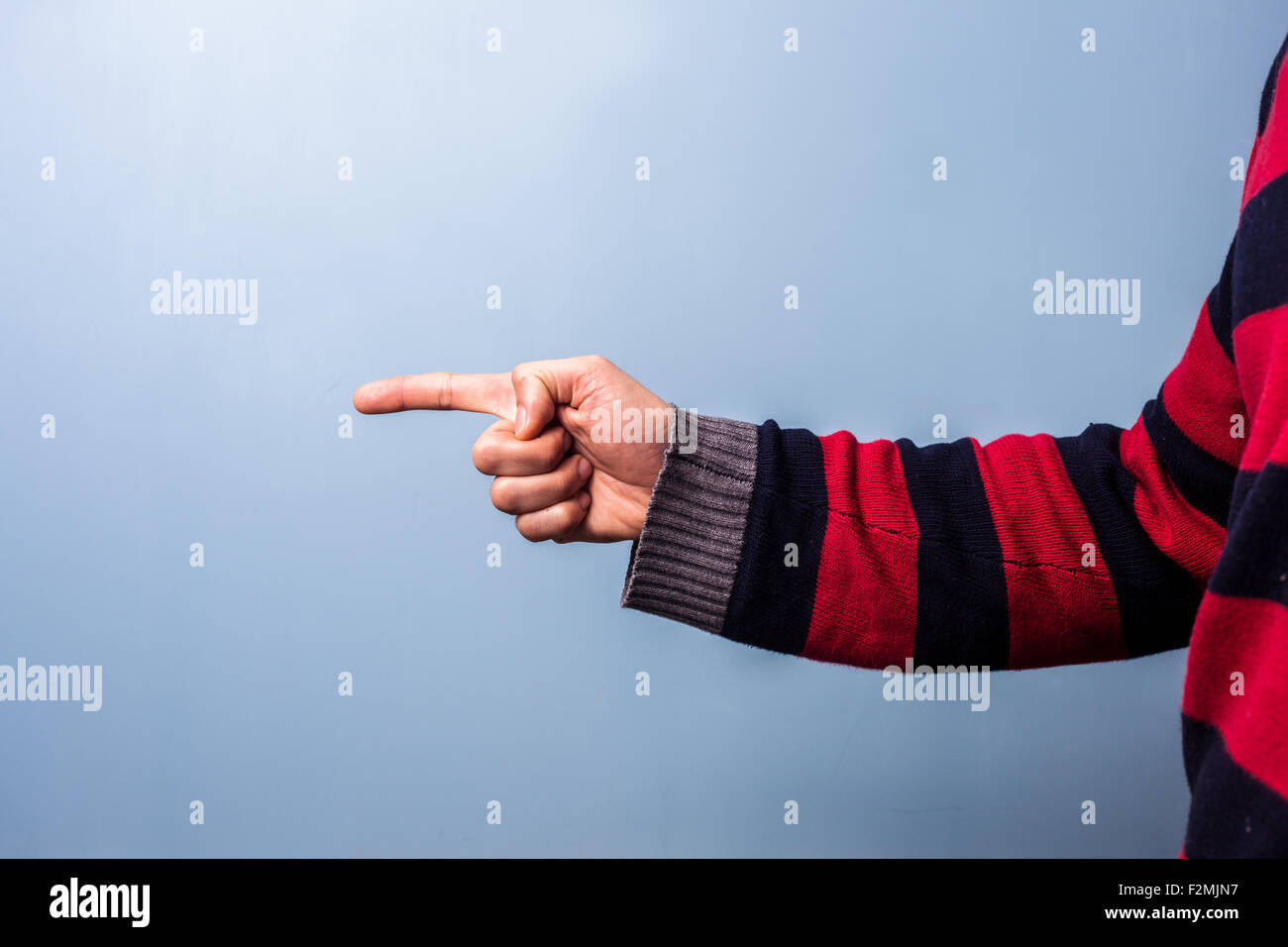 Young man's hand pointing Stock Photo - Alamy