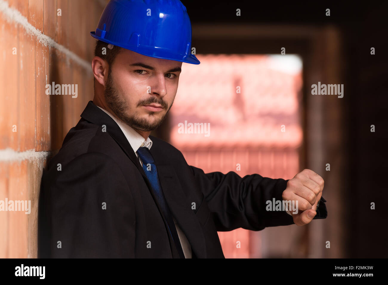 Engineer looking at watch hi-res stock photography and images - Alamy