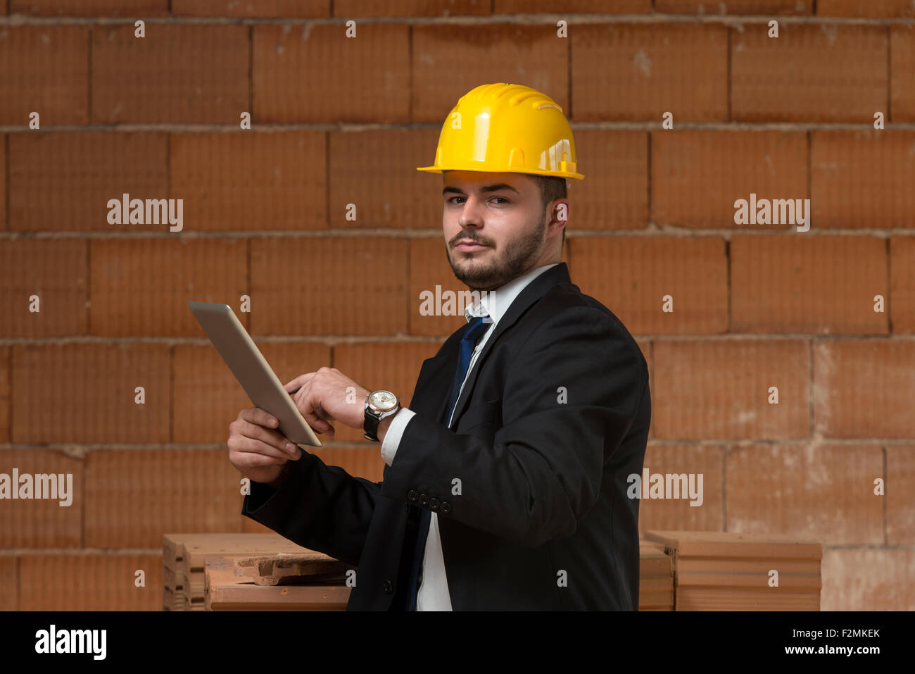 Portrait Of Construction Master With Personal Computer In Hands Stock ...